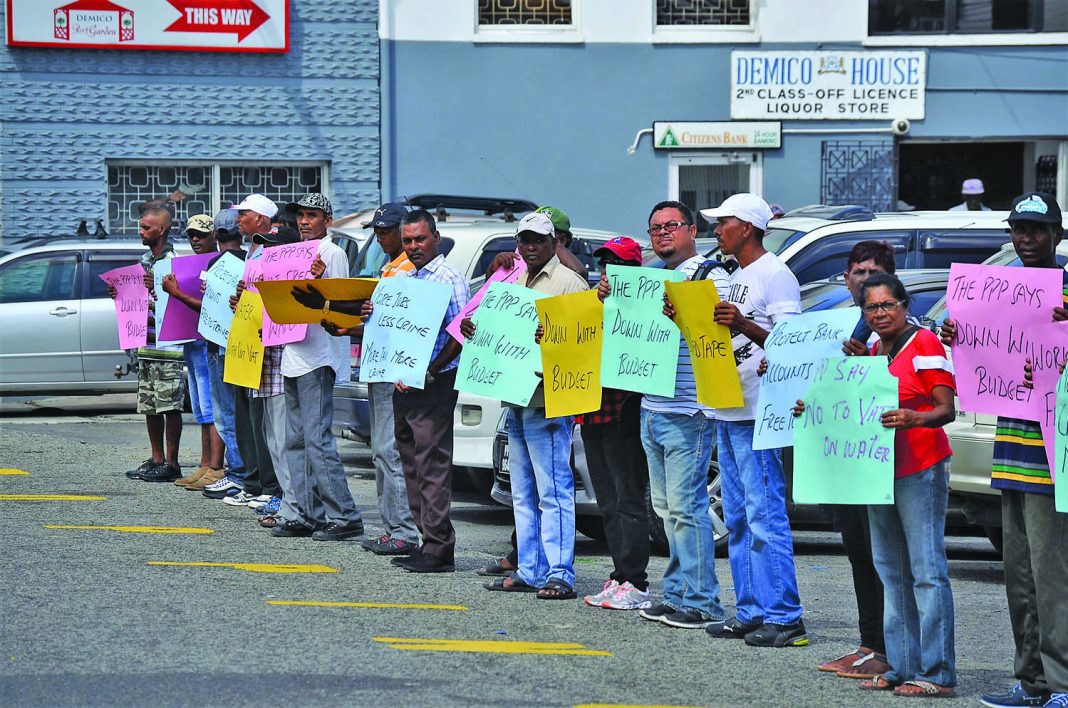 PPP supporters protest outside Parliament as debate begins - Guyana Times
