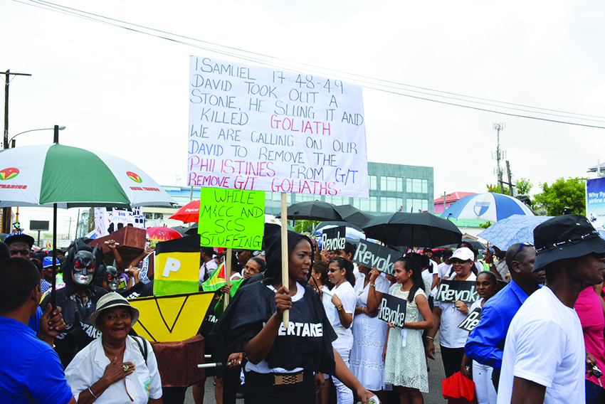 Protesters stage mock funeral for meters, City Hall & by-laws - Guyana ...
