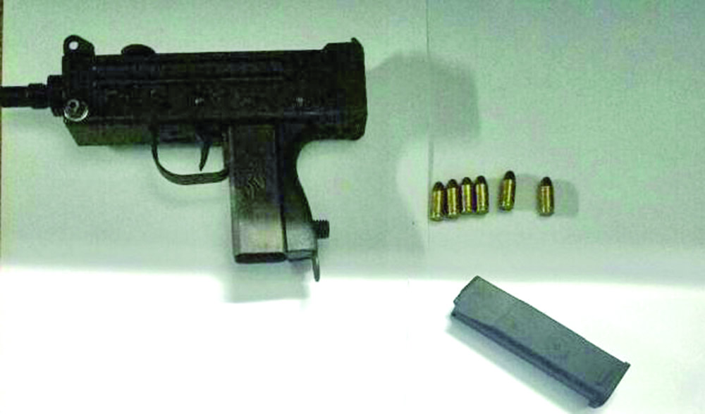 Unlicensed .32 pistol, sub-machine gun, ammo found - Guyana Times