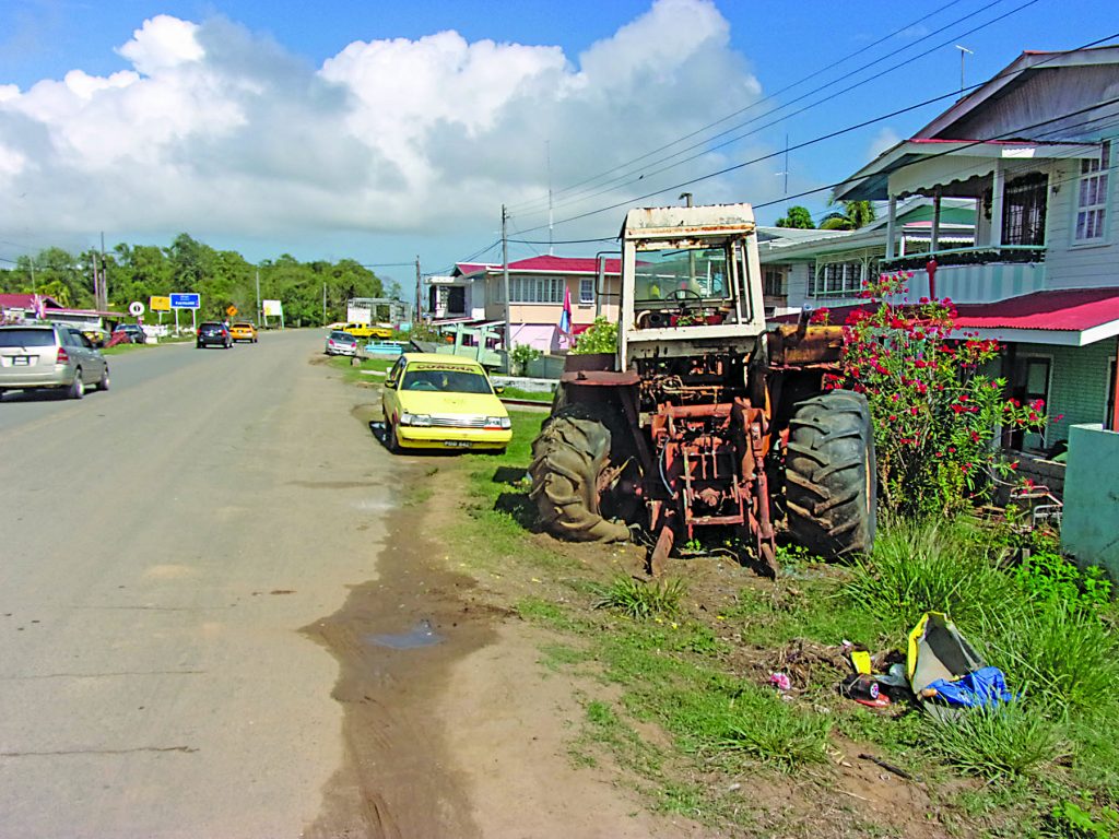 Taxi driver dies after slamming into parked tractor - Guyana Times