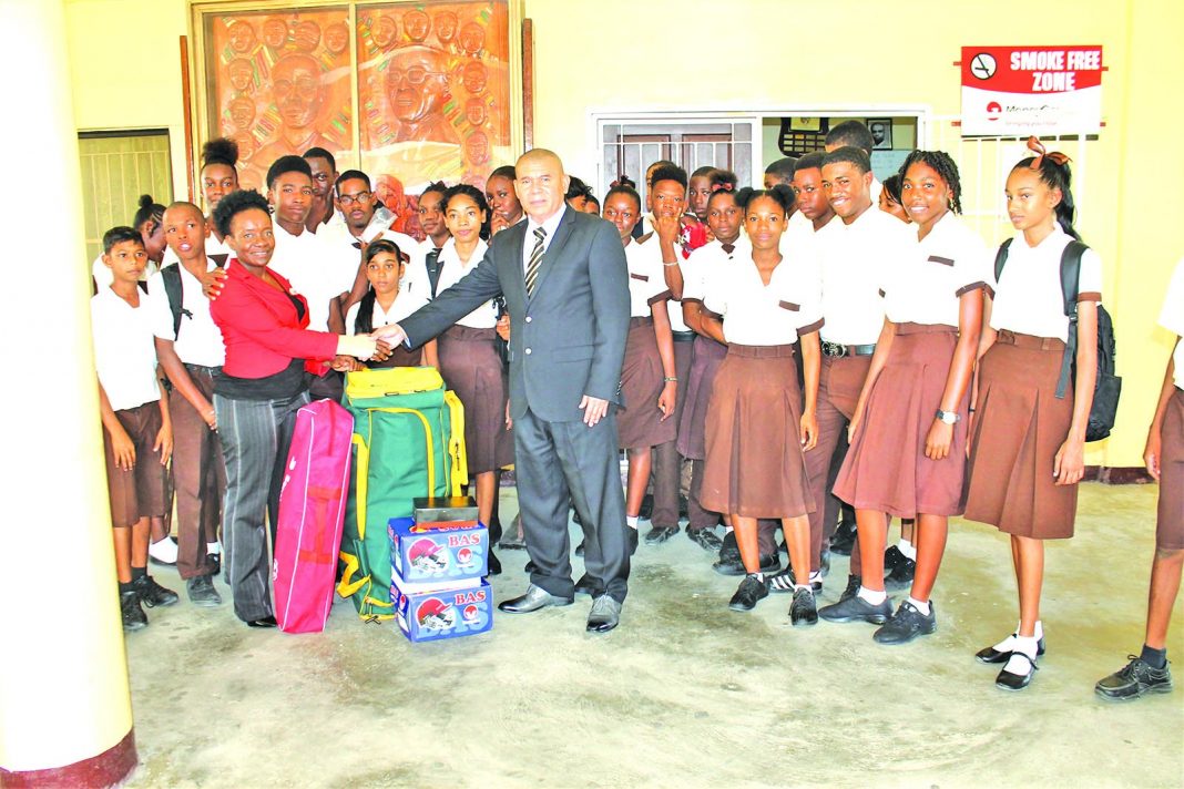 Minister Norton makes donation of cricket gear to Tutorial High School ...