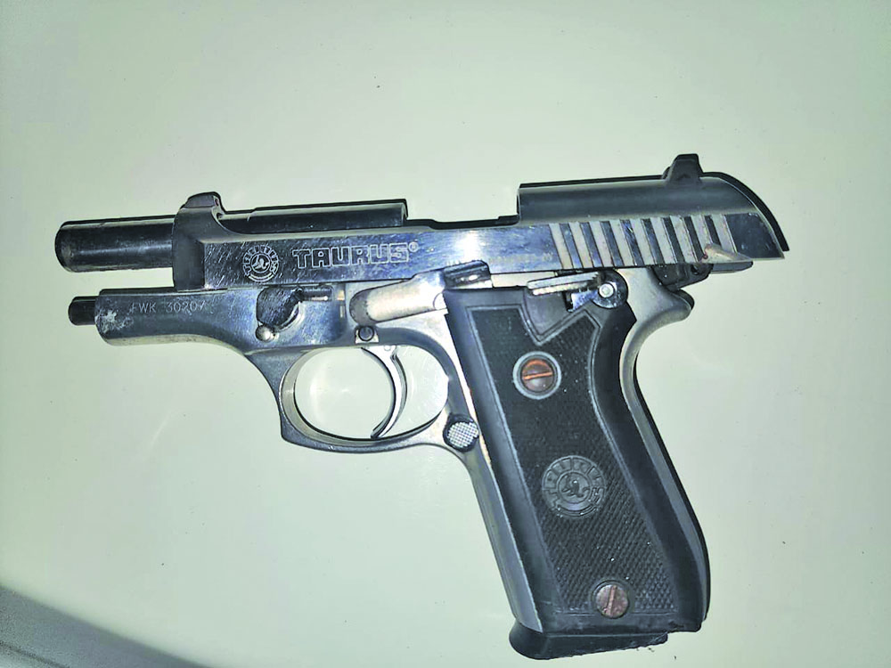 Police retrieve firearm dropped by escaping duo - Guyana Times