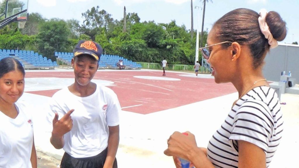 Olympian Edghill interacts with junior female windball players - Guyana ...