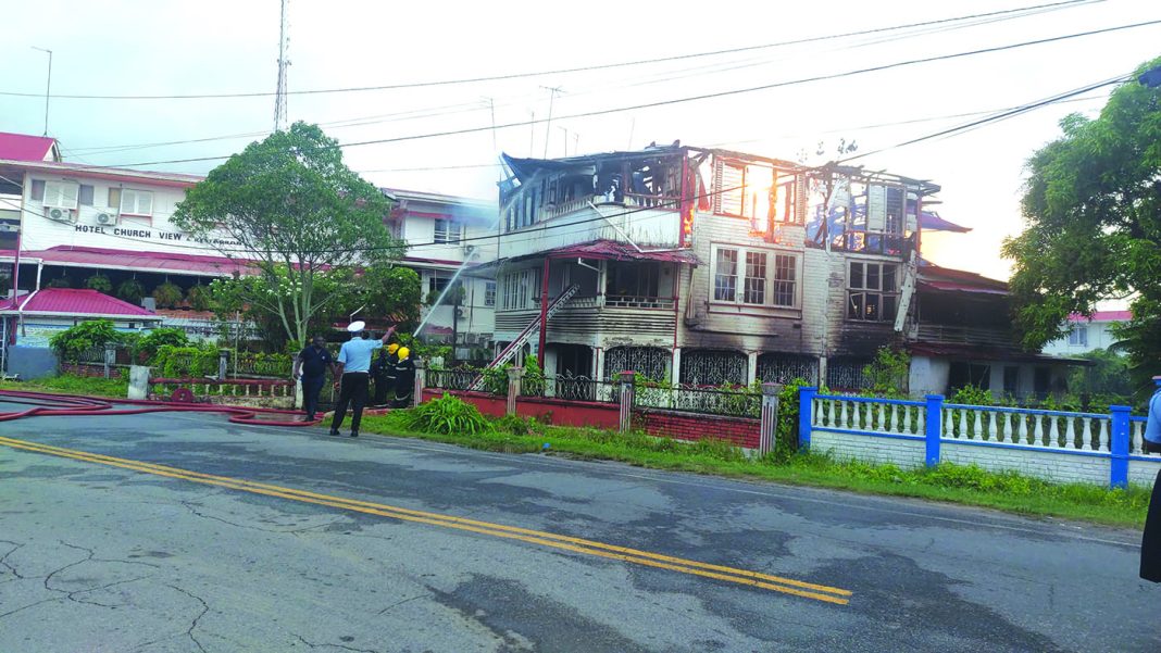 Firefighters battle blaze twice at abandoned NA building - Guyana Times